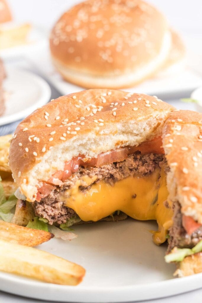 Juicy Lucy Stuffed Cheeseburgers - Tastes of Homemade