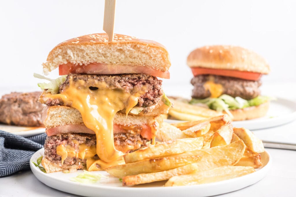 Juicy Lucy Stuffed Cheeseburgers - Tastes of Homemade